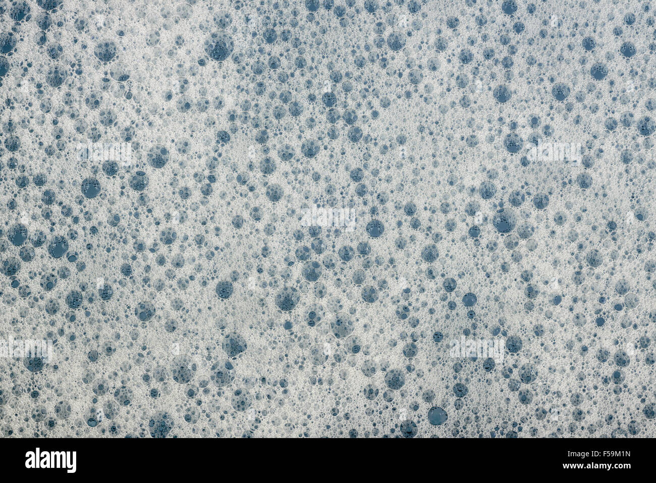 Foam soap suds bubbles water surface Stock Photo - Alamy