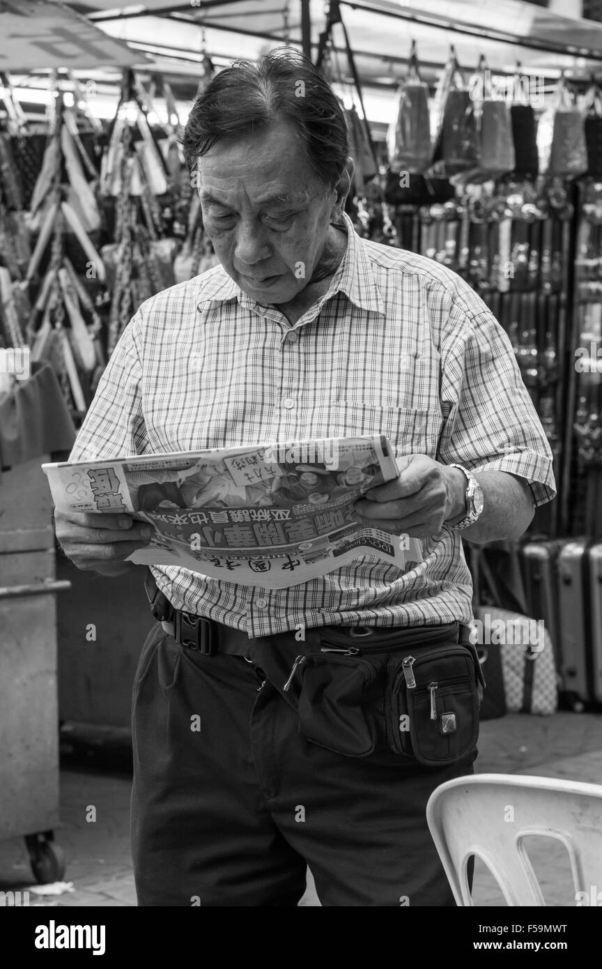 Reading the news paper Black and White Stock Photos & Images - Alamy