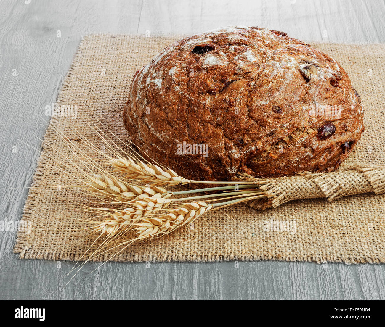 loaf of sour cherry and walnut rye bread on wooden background Stock ...