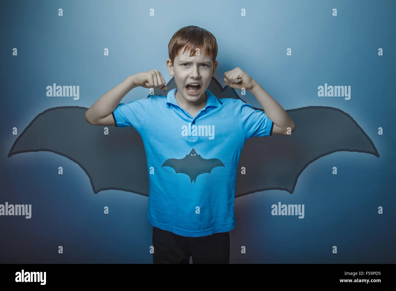 man superhero mouse teenage boy raised his hand shouts shows the power ...