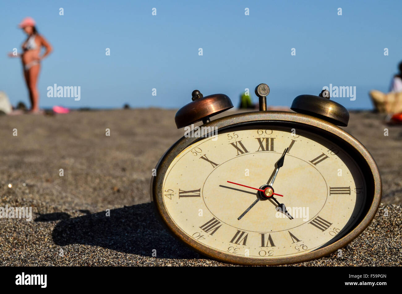 Clock on the Sand Beach Stock Photo - Alamy