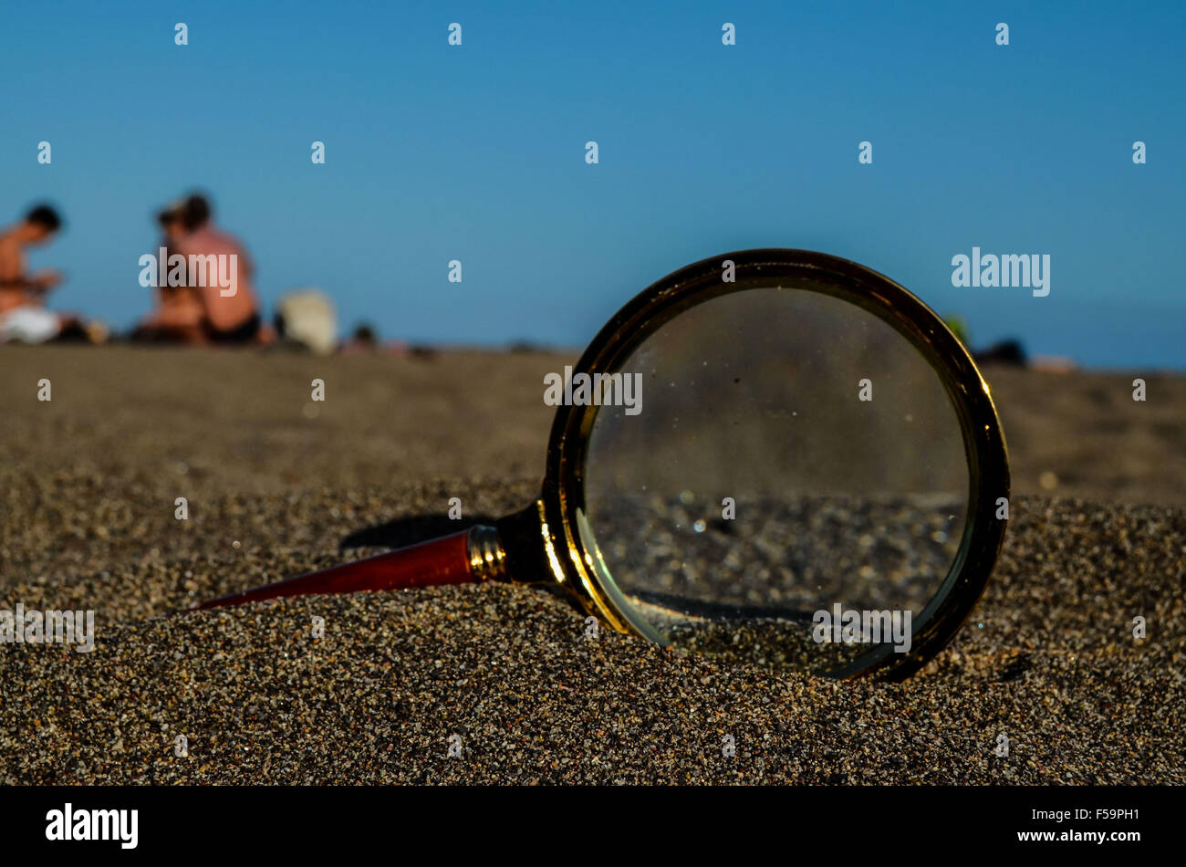 Magnify Glass on the Sand Beach Stock Photo - Alamy