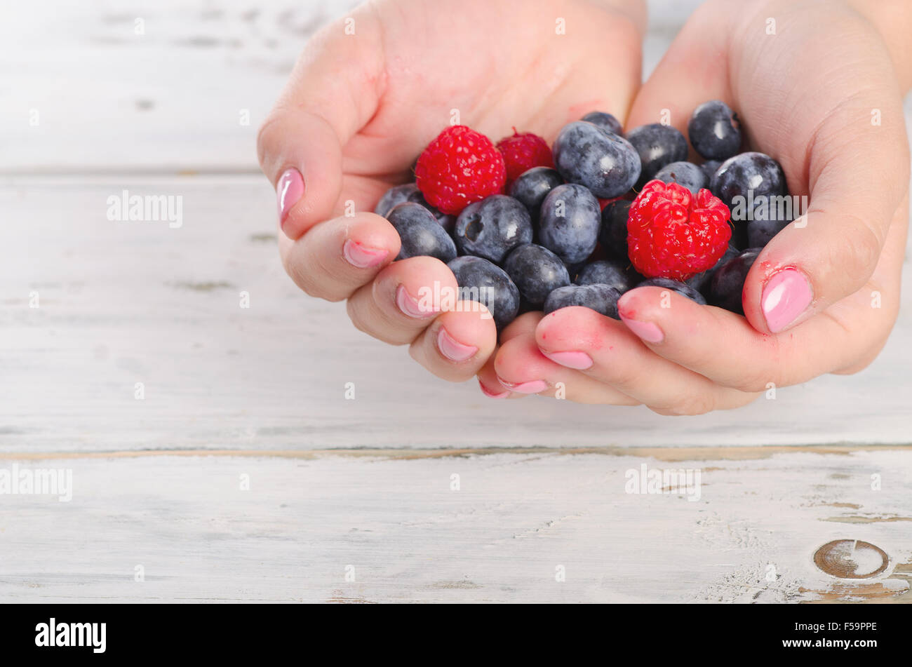 Hands and berries hi-res stock photography and images - Alamy