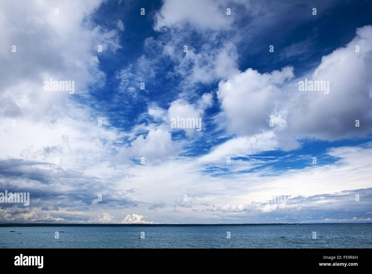 Blue sky with clouds at the sea Stock Photo - Alamy
