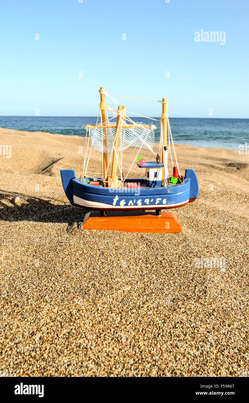 Toy Boat on the Sand Beach Stock Photo - Alamy