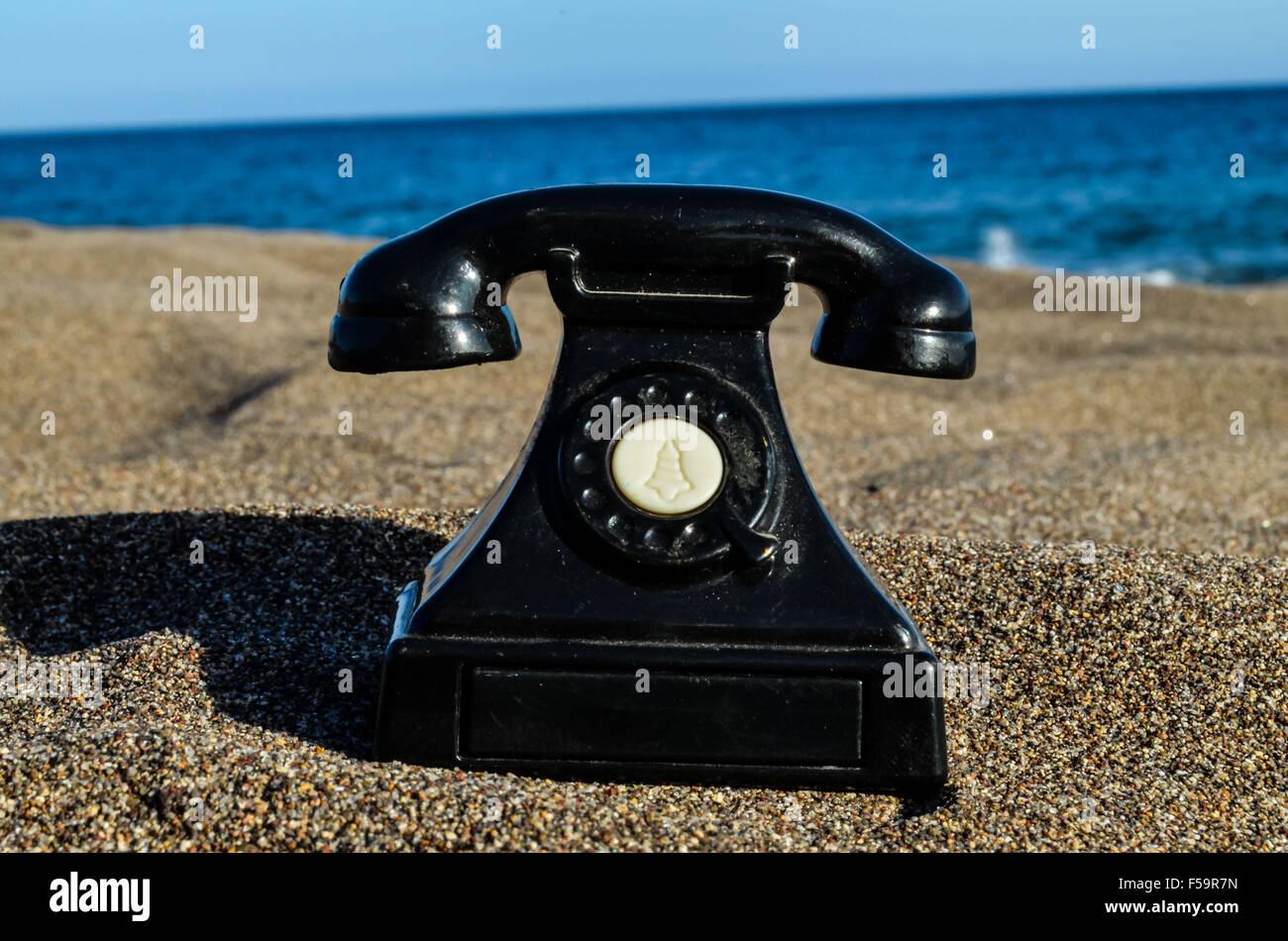 Phone on the Sand Beach Stock Photo - Alamy