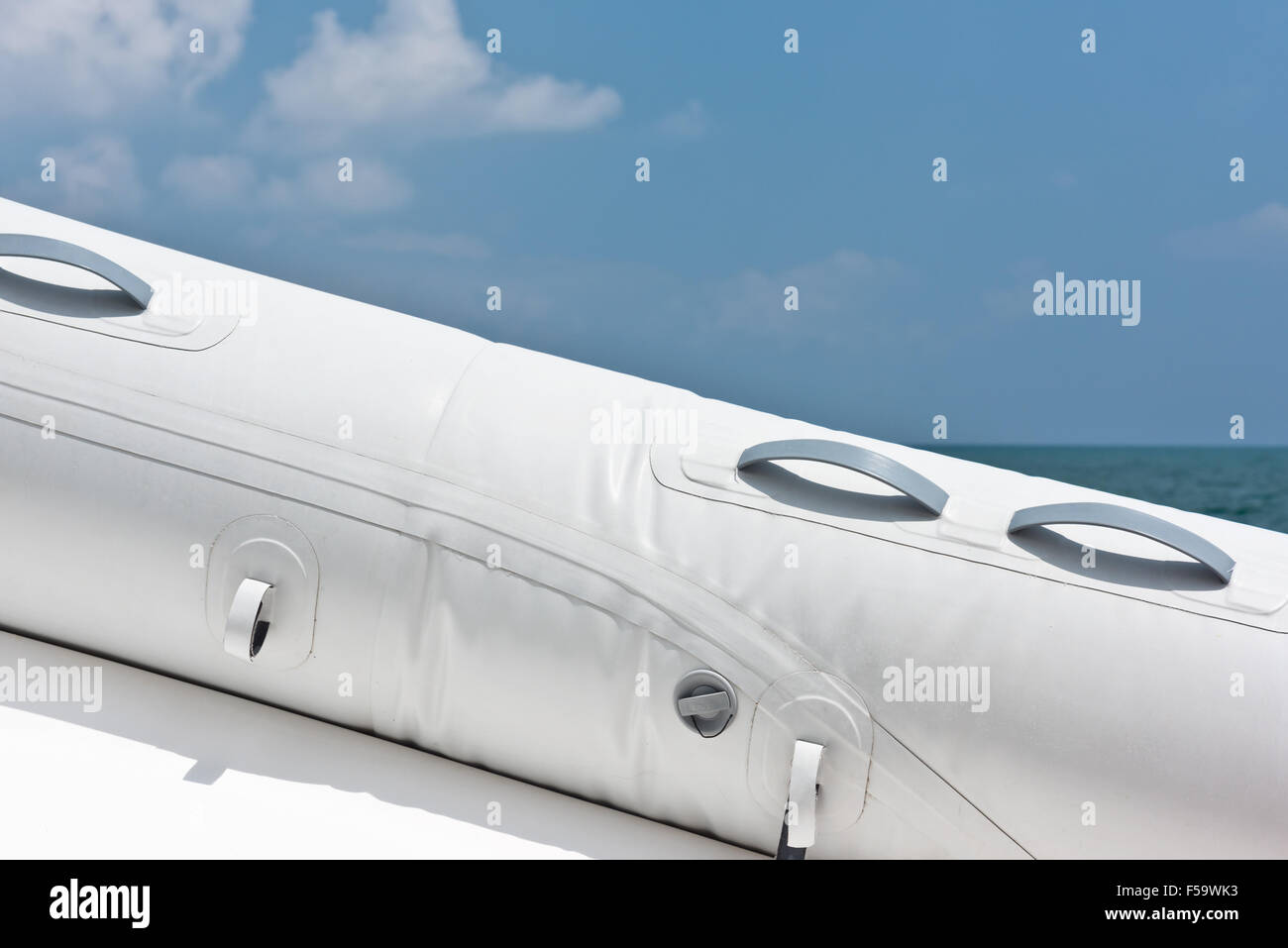 Detail of an inflatable rubber motor boat side. Outdoor shot Stock ...
