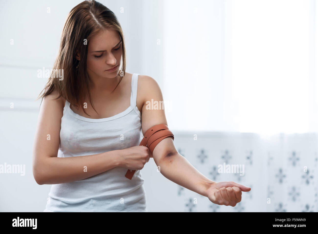 Depressed girl taking drugs Stock Photo - Alamy