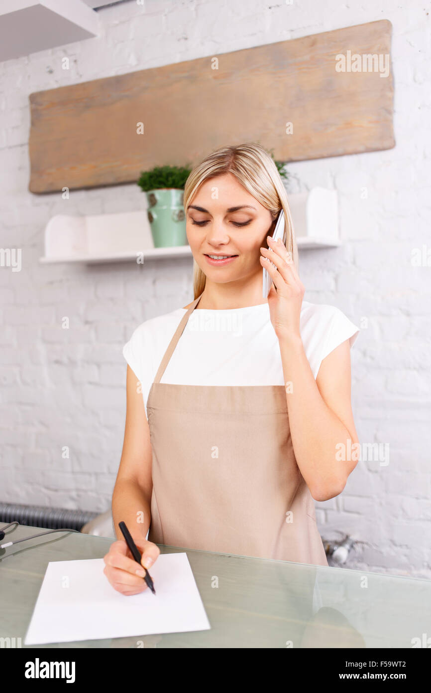 Professional florist working in a flower shop Stock Photo - Alamy