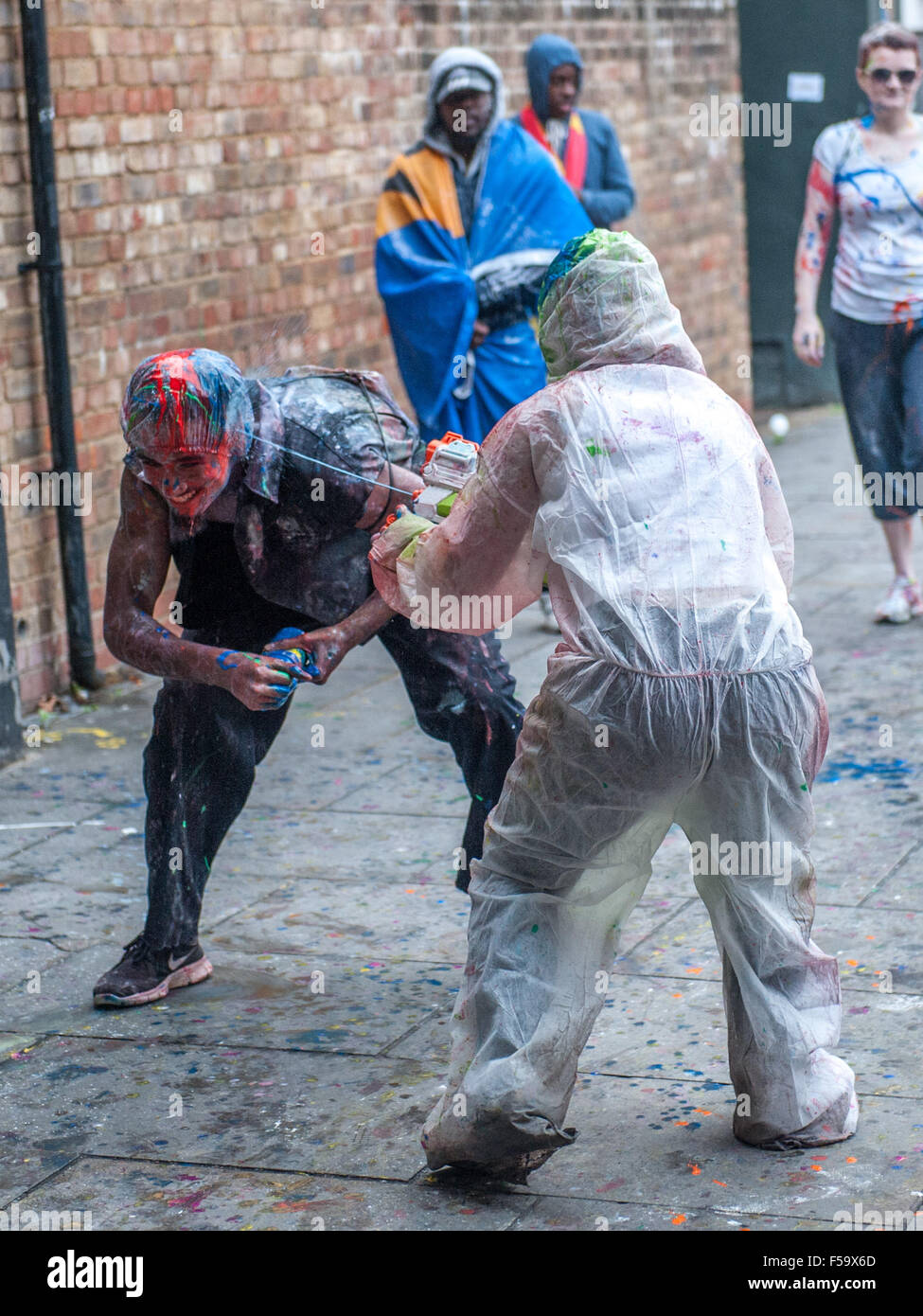 Starting at 6am, revellers doused each other in paint and talcum powder ...
