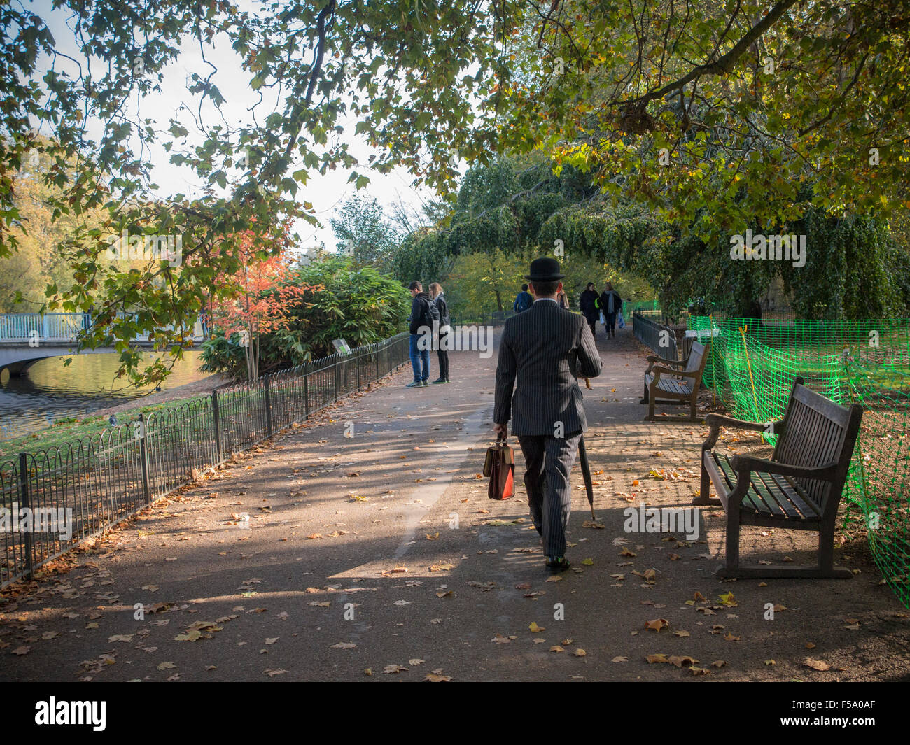 A classic english businessman wearing a pinstriped suit with a ...