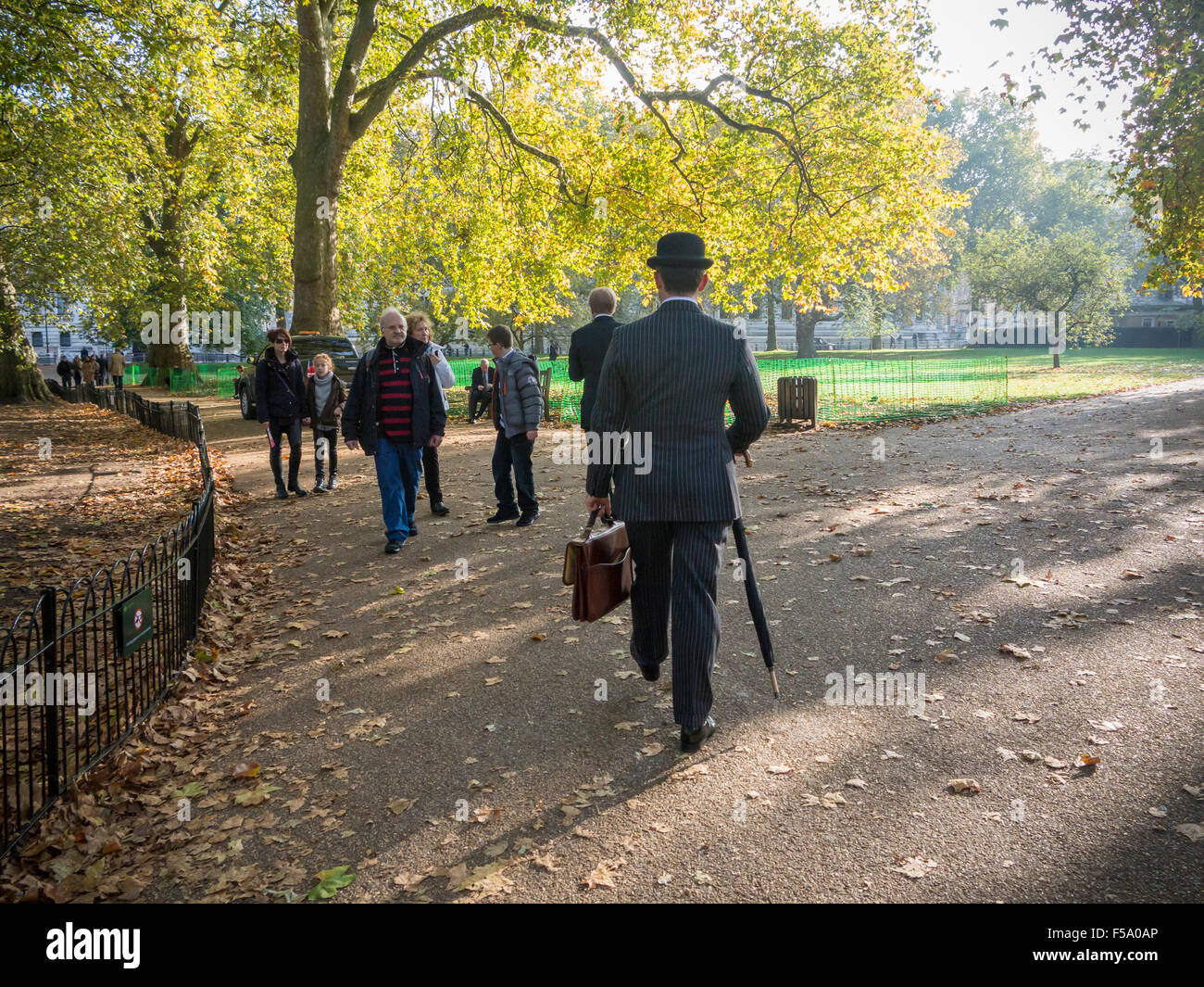A classic english businessman wearing a pinstriped suit with a ...