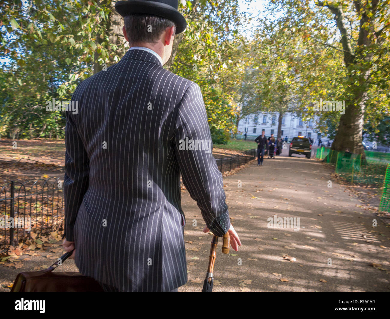 A classic english businessman wearing a pinstriped suit with a ...