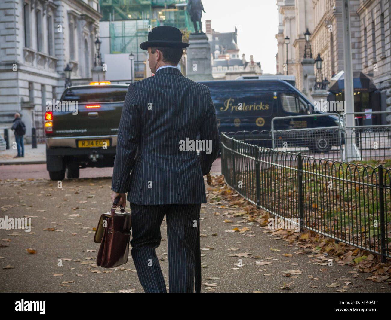 A classic english businessman wearing a pinstriped suit with a ...