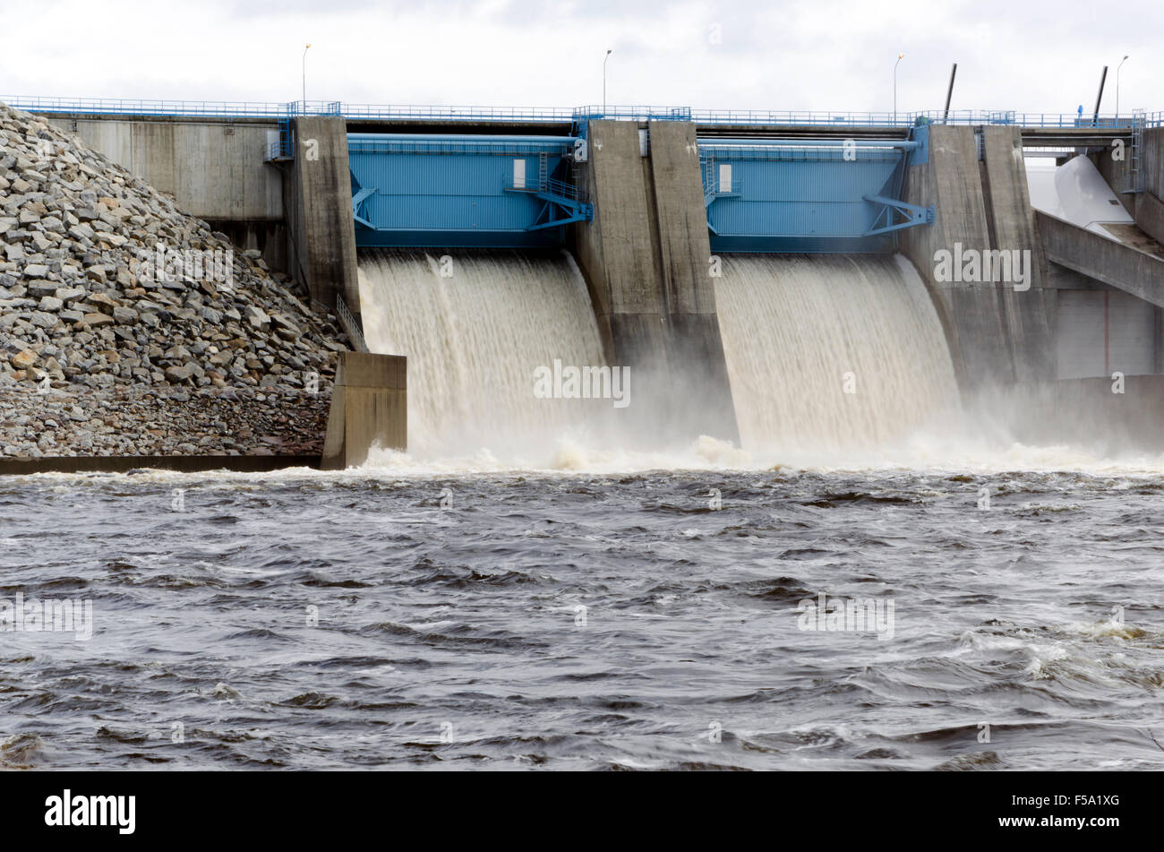 Open floodgates on a dam in a river from the North of Sweden Stock ...
