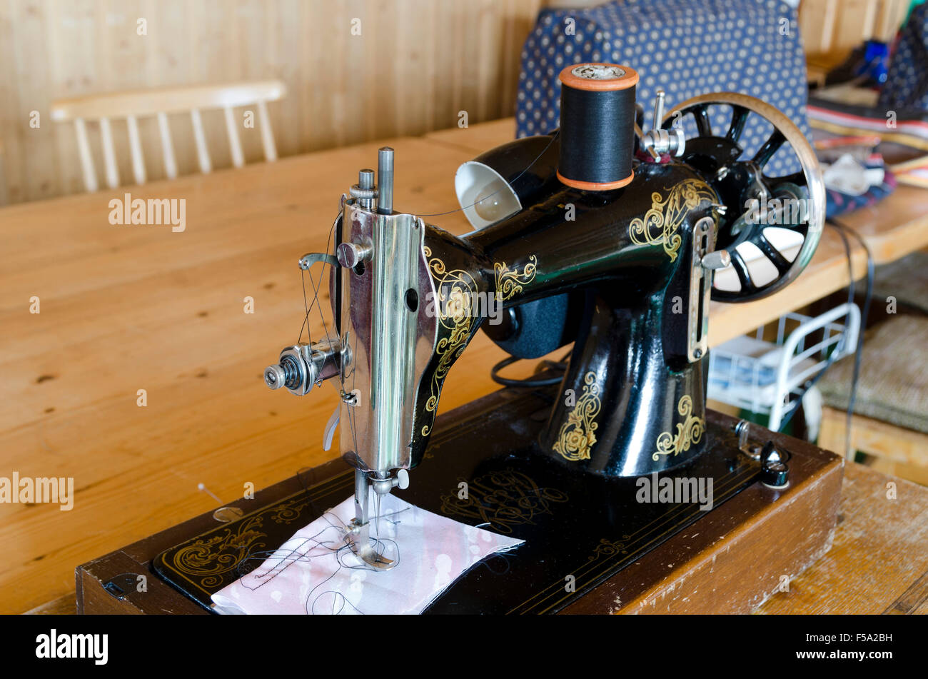 Old beautiful sewing machine still working,standing on a table Stock ...