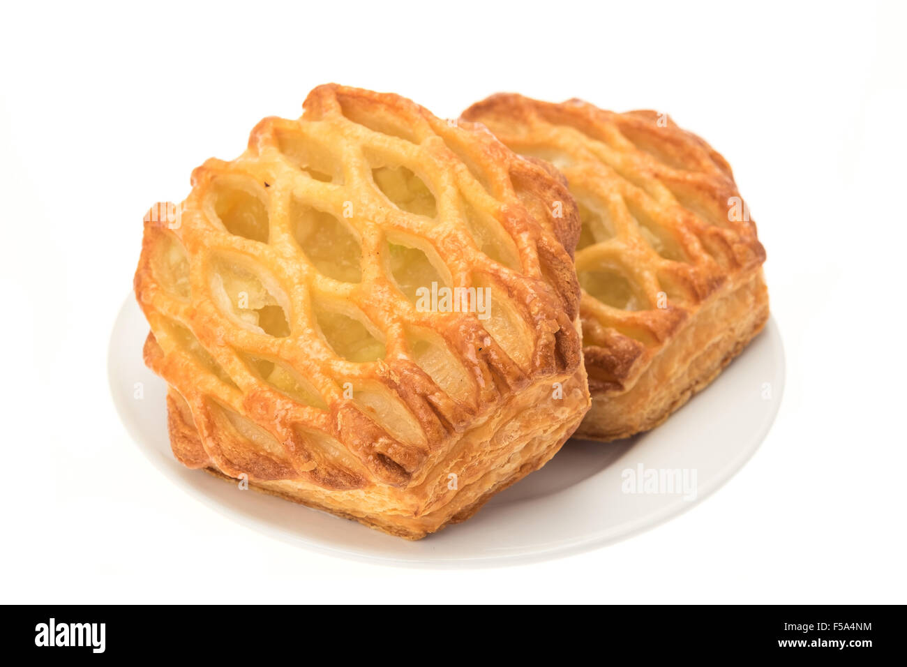 Two apple lattice cakes on a plate - white background Stock Photo - Alamy