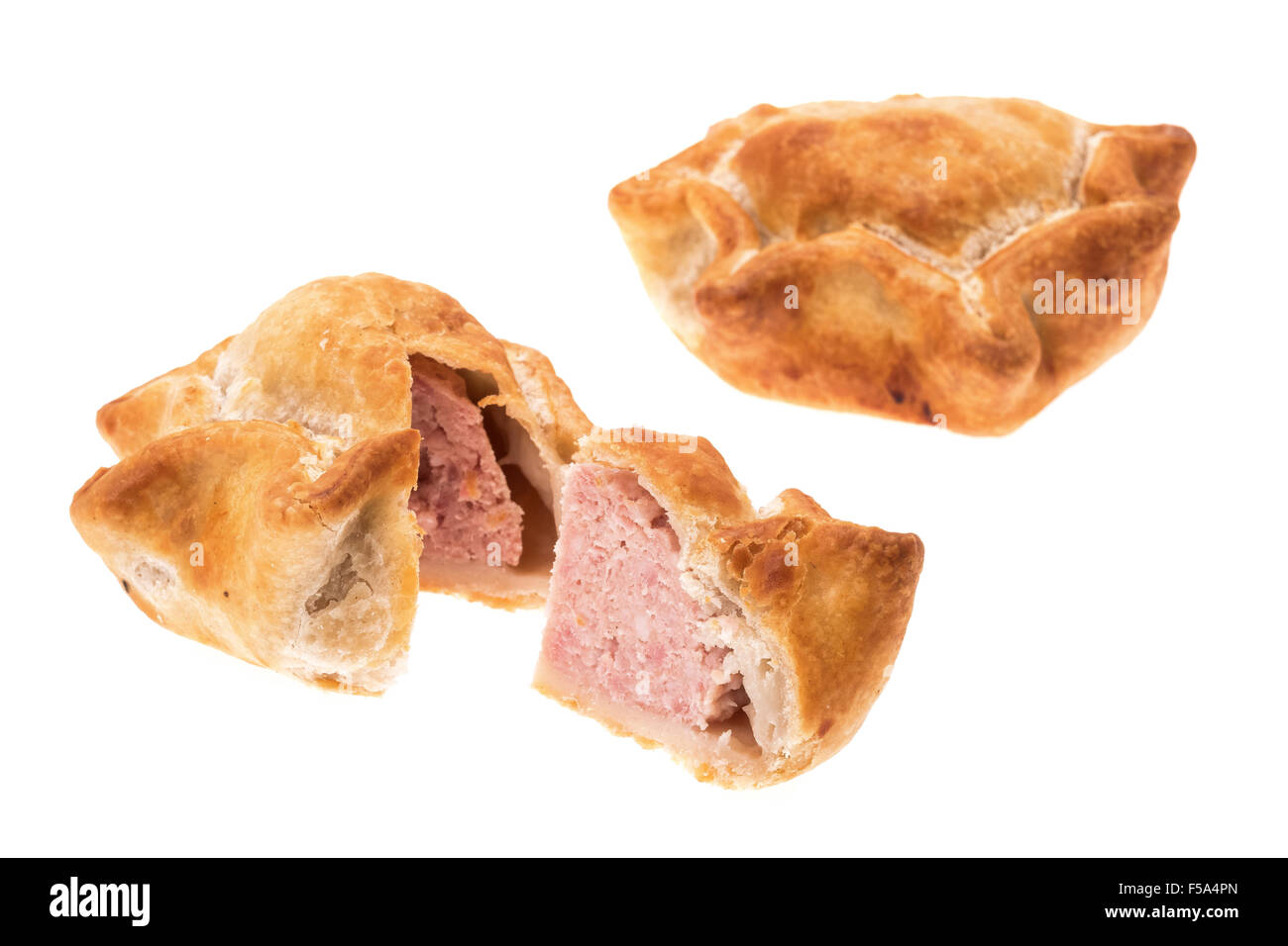 Two pork pies and a slice - white background Stock Photo - Alamy