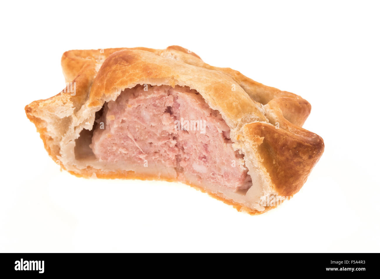 A cut open pork pie - white background Stock Photo - Alamy