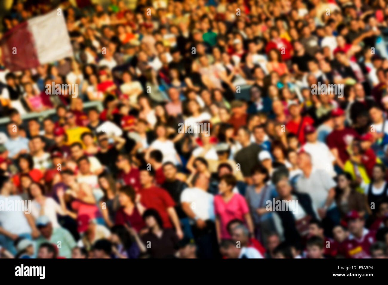 Crowd of people at a soccer match - blurred image Stock Photo - Alamy