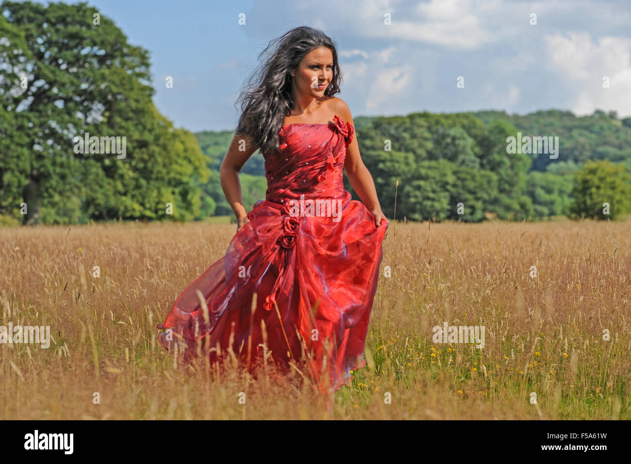 Red dress in a field,fashion sred,dress,field,fashion,fashion shoot ...
