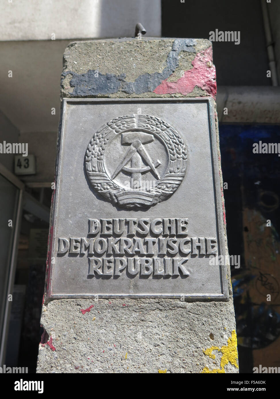 German Democratic Republic Logo at Checkpoint Charlie, Berlin Stock ...