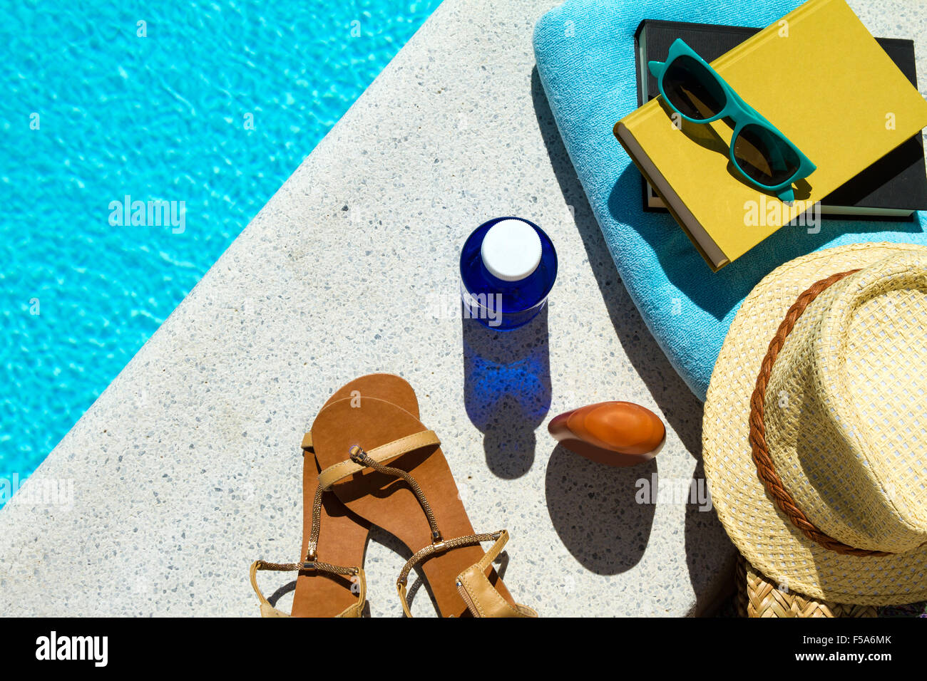 Reading near the swimming pool Stock Photo - Alamy