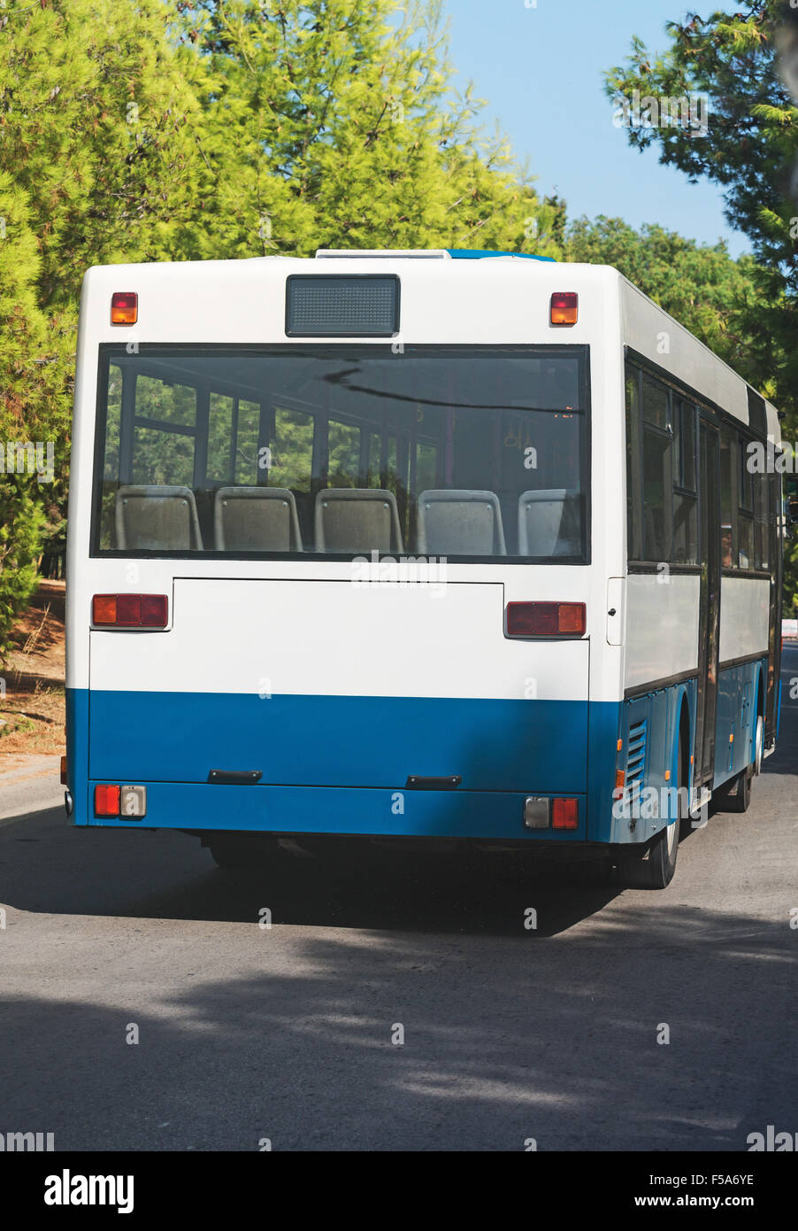Rear view of empty city bus Stock Photo - Alamy
