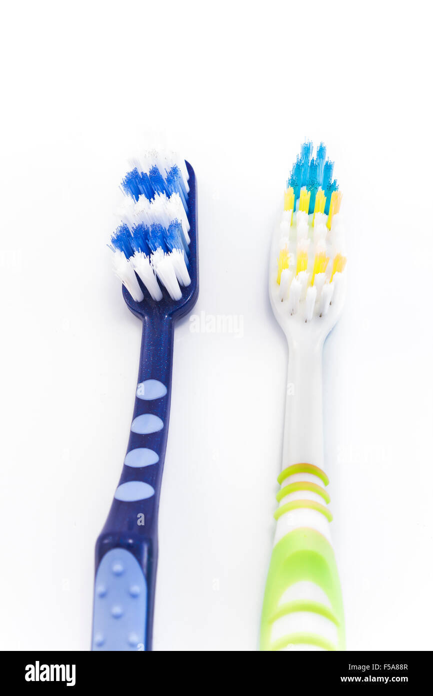 Two toothbrushes isolated on white Stock Photo - Alamy