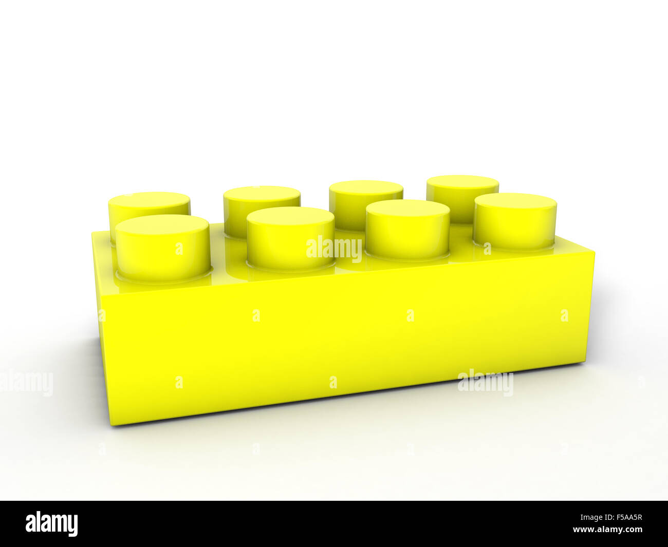 Yellow lego block on a white background Stock Photo - Alamy