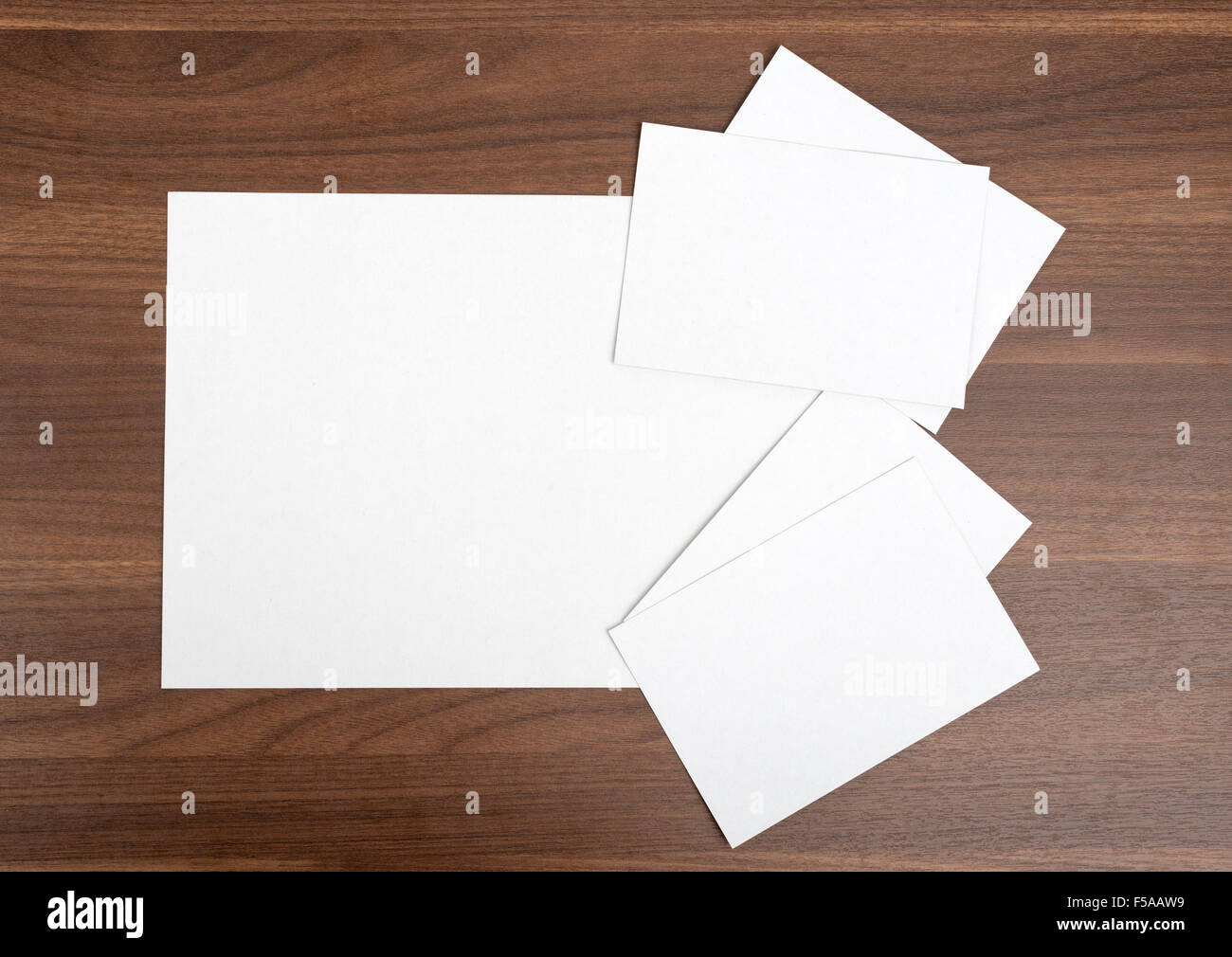 Several empty cards on wood table Stock Photo - Alamy