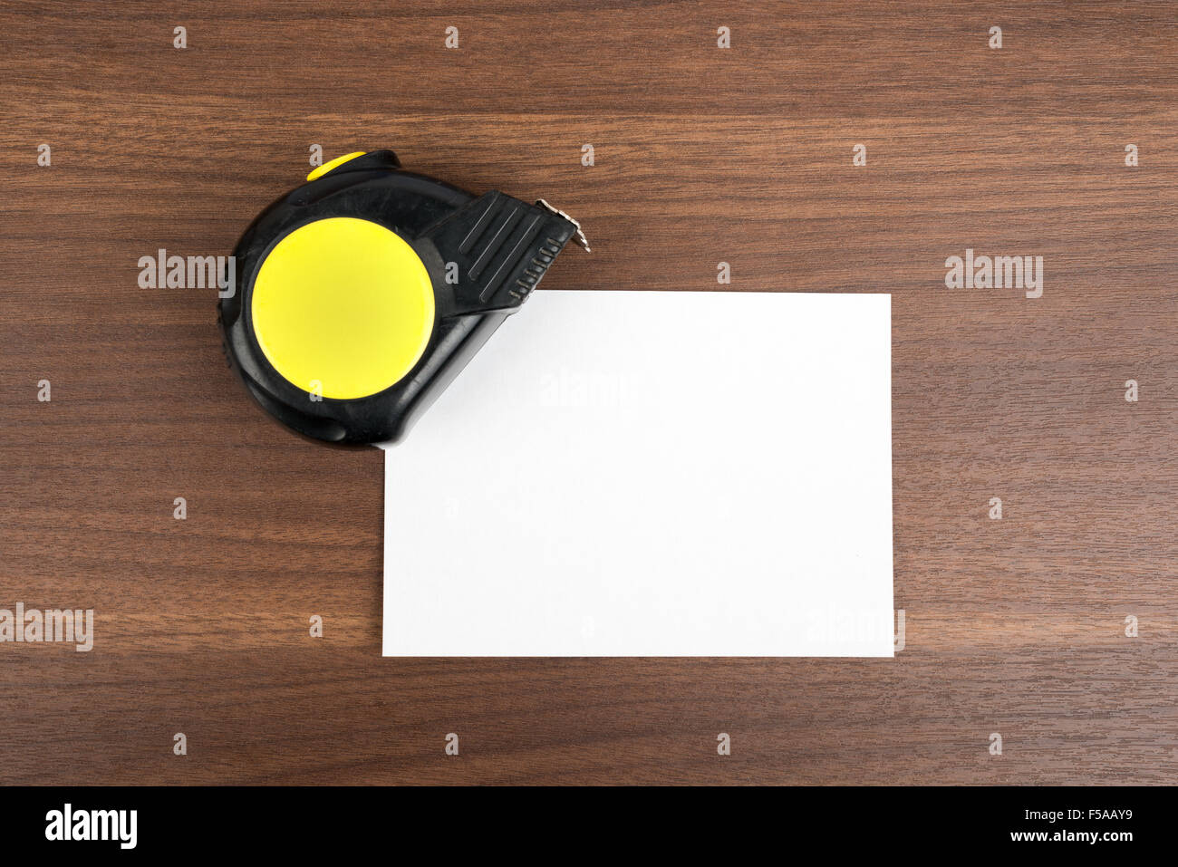 Blank card with tape-measure, top view Stock Photo - Alamy
