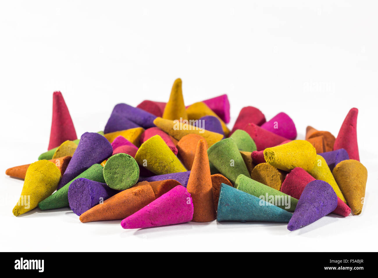Colorful incense cones with white background Stock Photo - Alamy