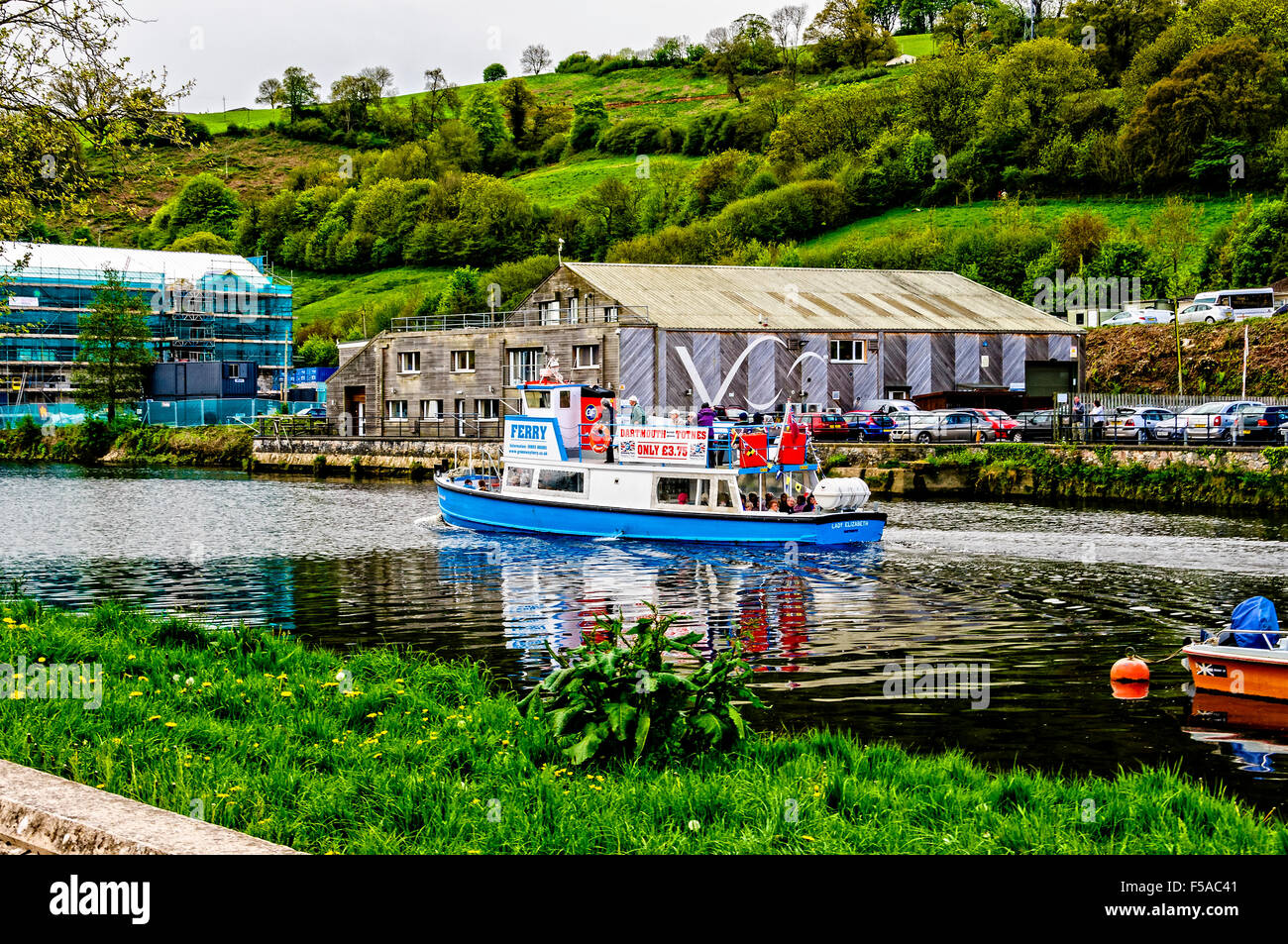 Passengers aboard the ferry Lady Elizabeth sail along the tranquil ...