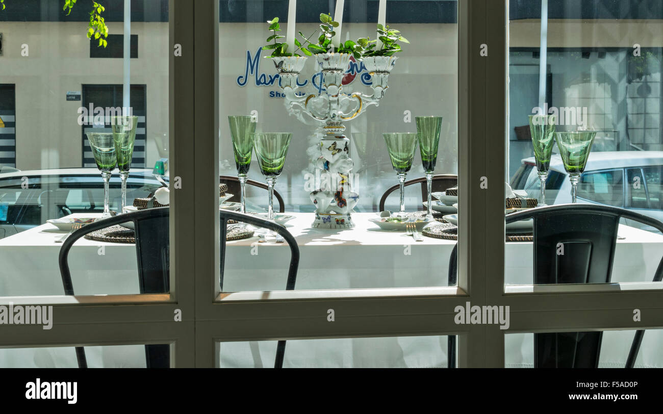 WINDOW DISPLAY IN A STORE OF TABLE SETTINGS ELABORATE CANDLE HOLDER AND ...