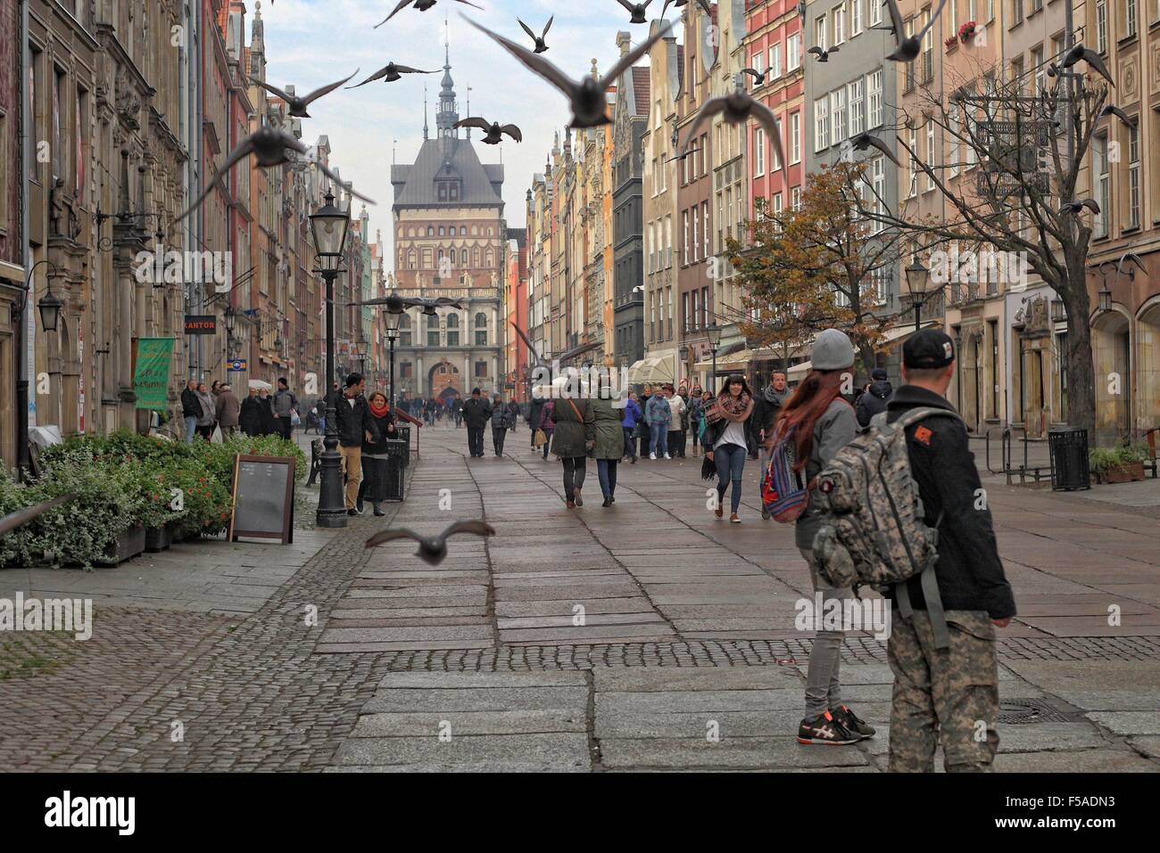 Gdansk, Poland 31st, Oct. 2015 People look at the pigeons at the Dluga ...