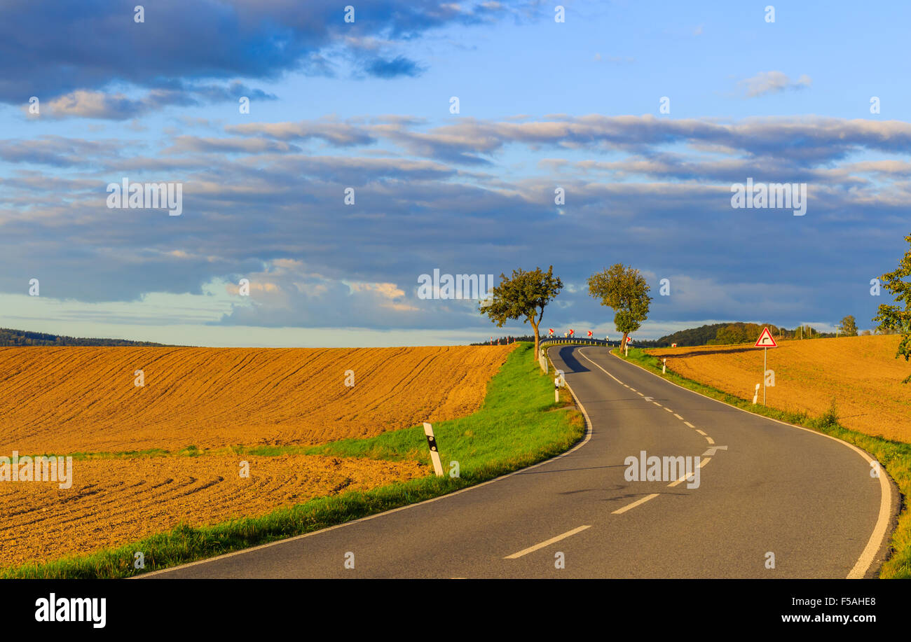 Panoramic landscape of colorful yellow-green hills with ground road ...