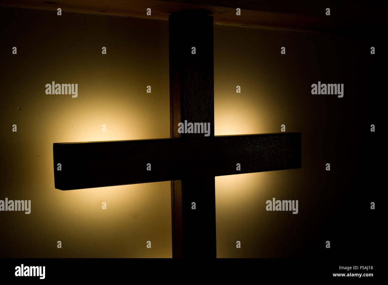 cross with light shining from behind. Ideal for churches Stock Photo ...