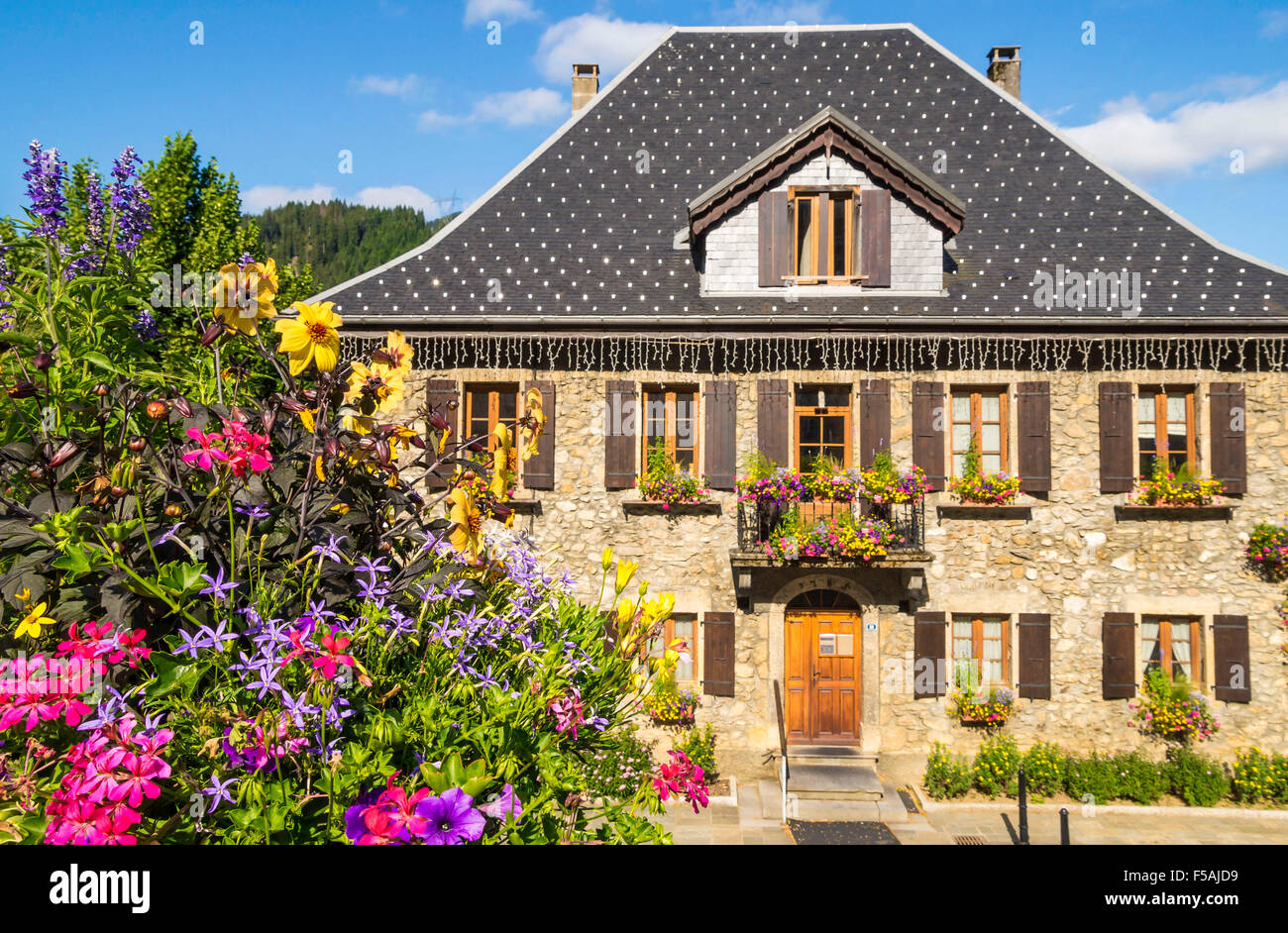 Traditional French house with flowers and wooden windows Stock Photo ...