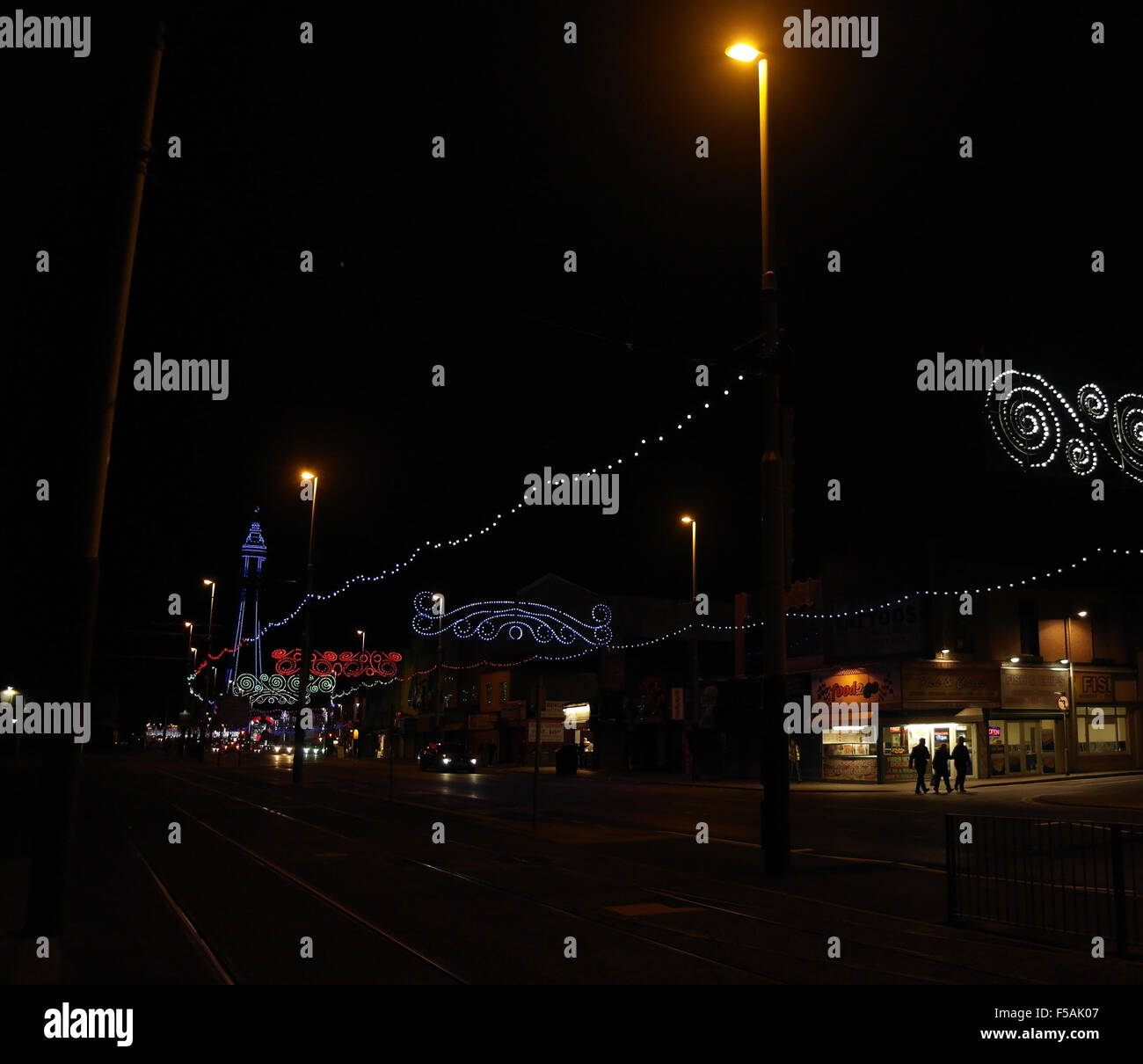 Night view, north to blue Blackpool Tower, colourful Scrolls ...