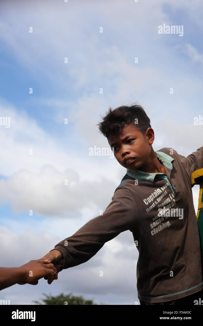 Boy reaching out for hand Stock Photo - Alamy
