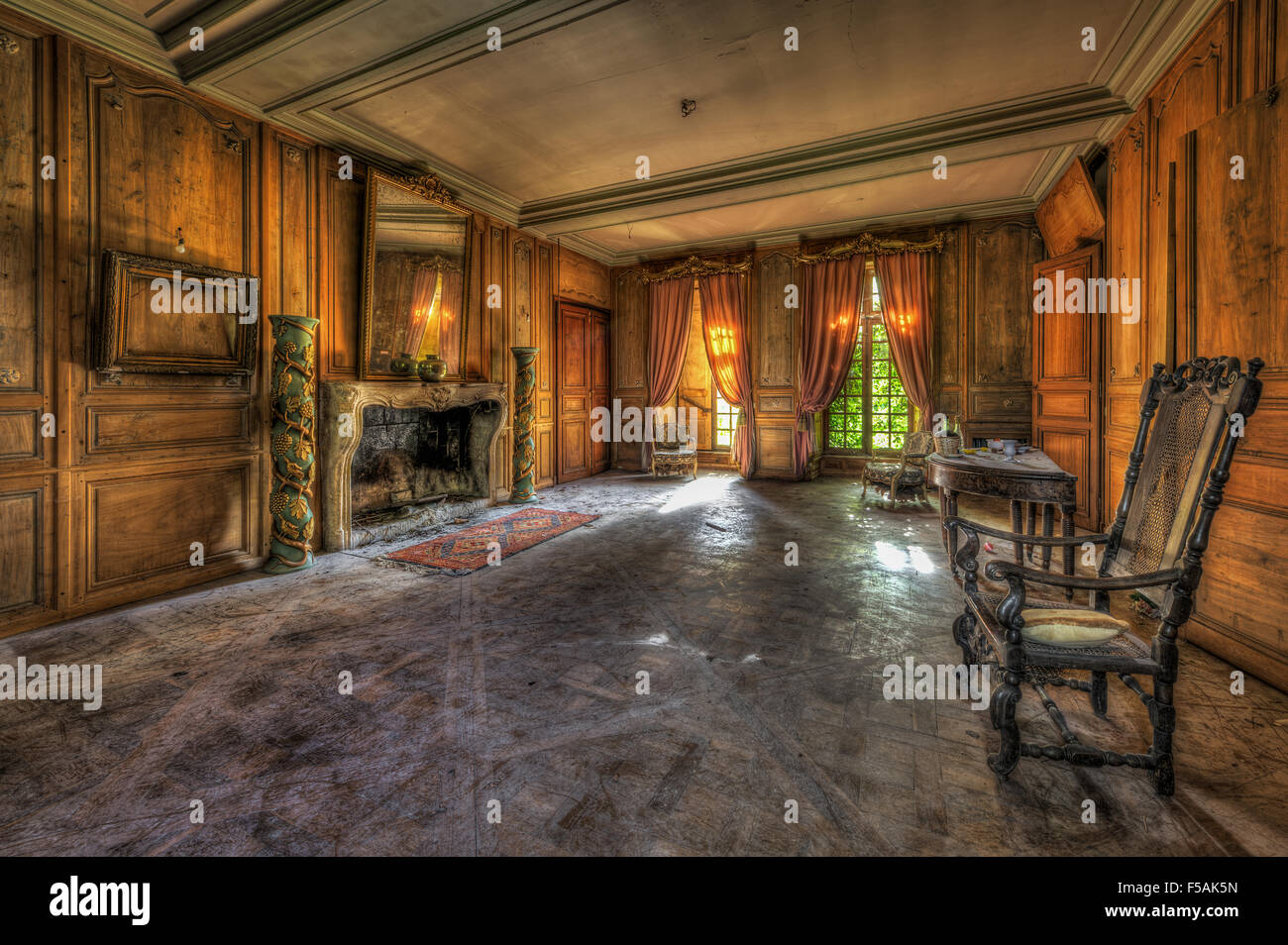 Dilapidated luxurious living room in an abandoned castle Stock Photo ...