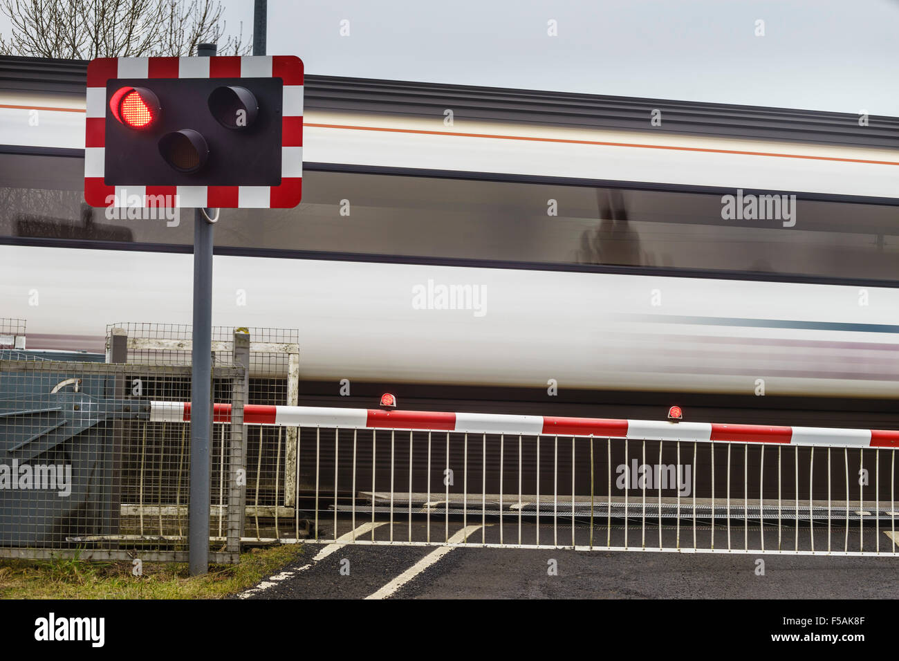 Red stop lights at railway level crossing, East Coast main line near ...