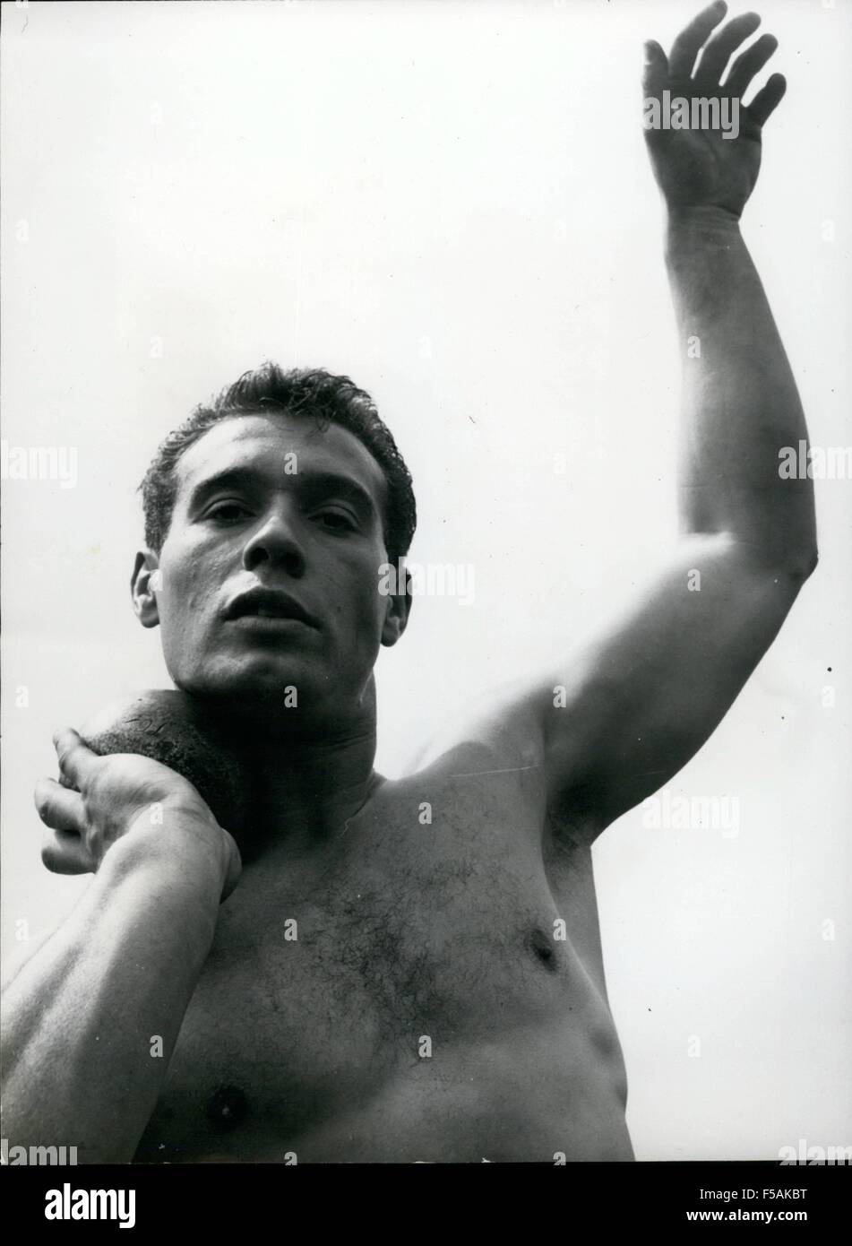 1958 - Arthur Rowe nestles the shot in the angle of his neck, at the ...