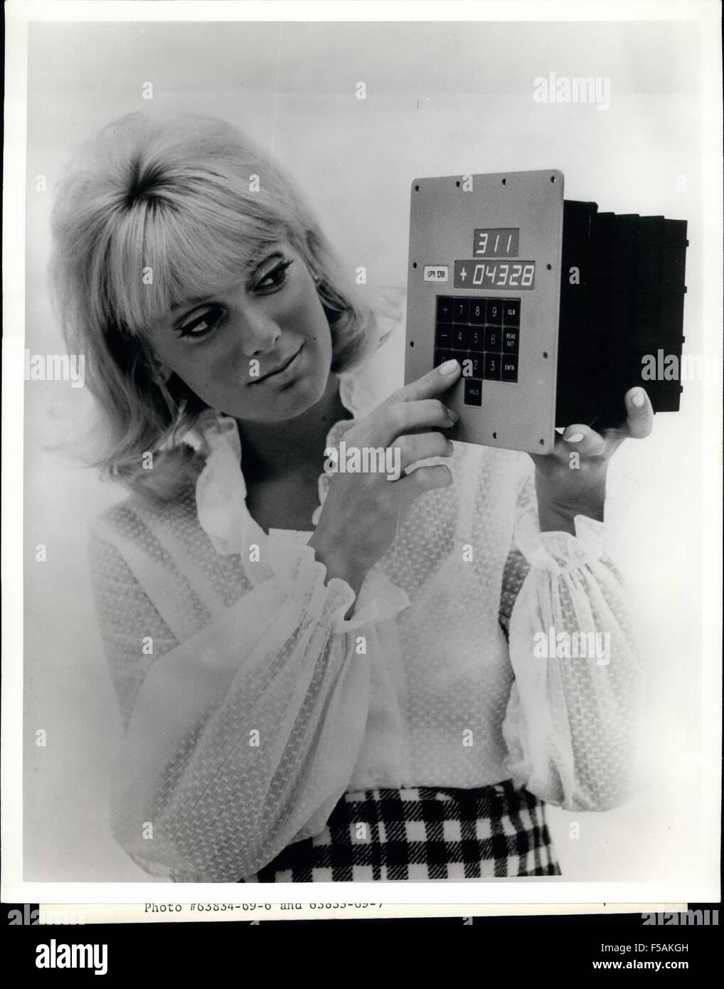 1968 - Pretty Sharon Mullins of TRW is holding control panel for back ...