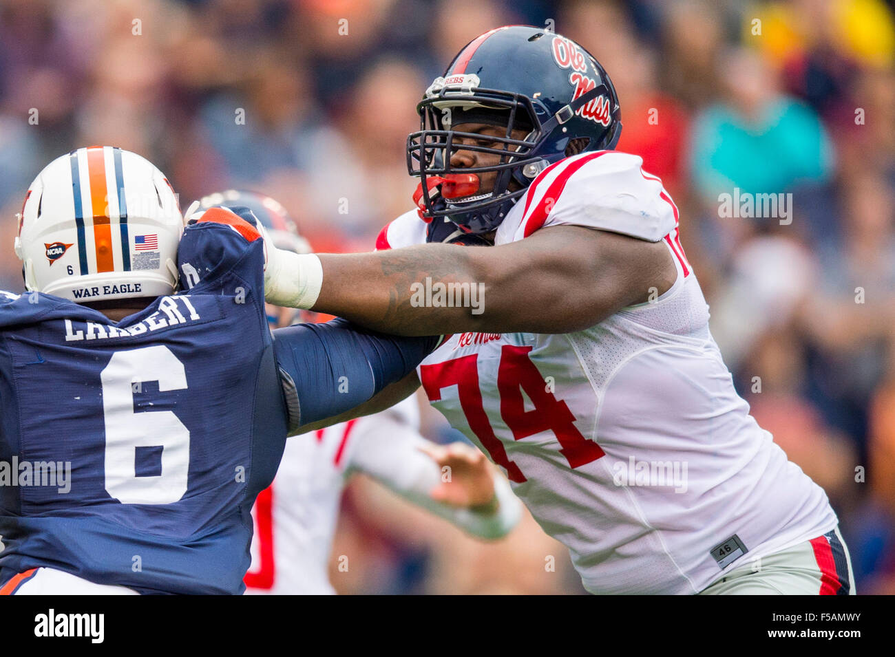 Ole Miss offensive lineman Fahn Cooper (74) and Auburn defensive ...