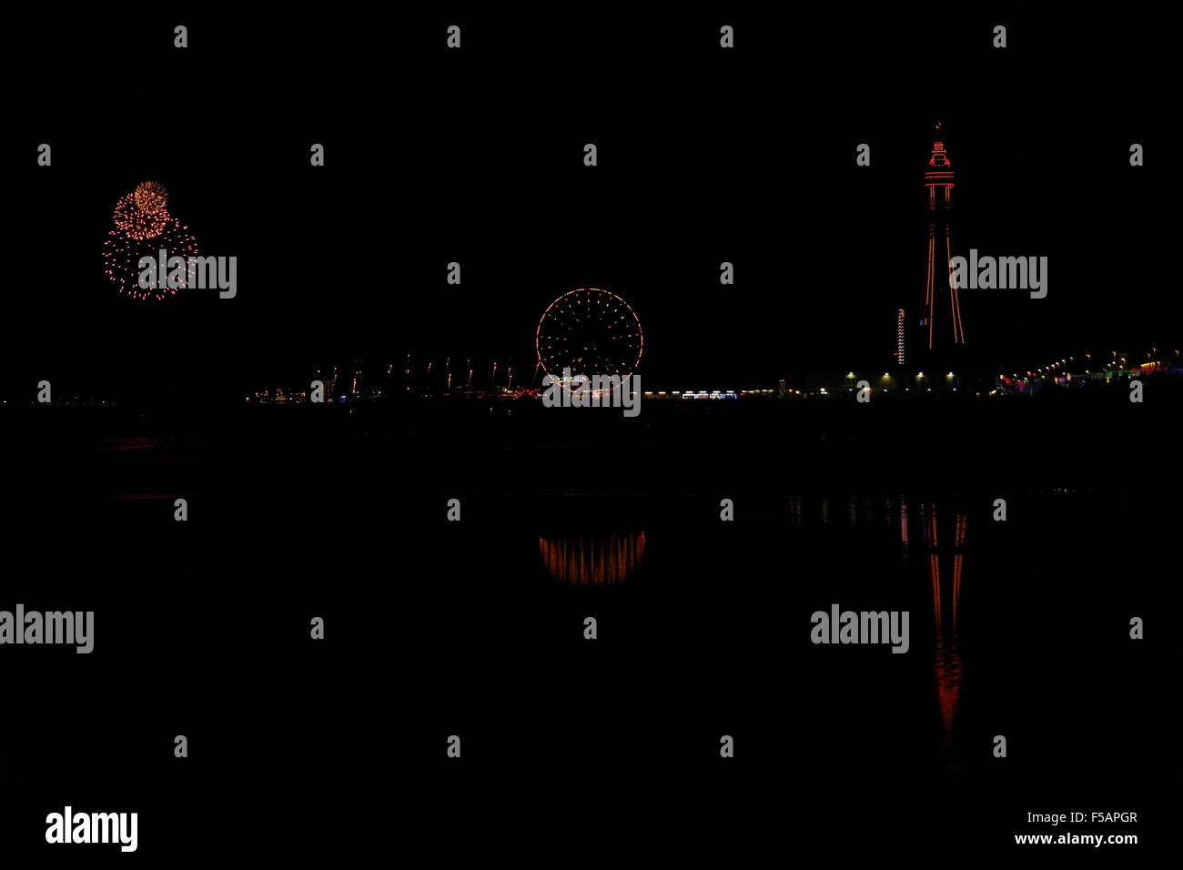 Night beach view, with reflections, north to red Blackpool Tower and ...