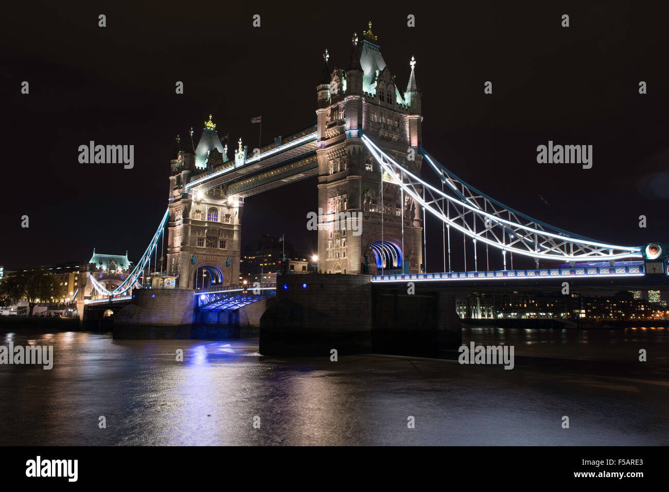 An illuminated Tower Bridge on the River Thames, London, England, UK ...