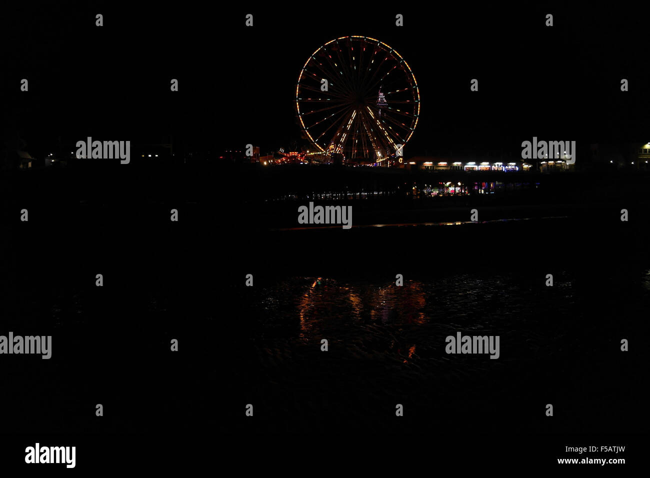 Night view, with reflections, north to Central Pier Big Wheel in front ...