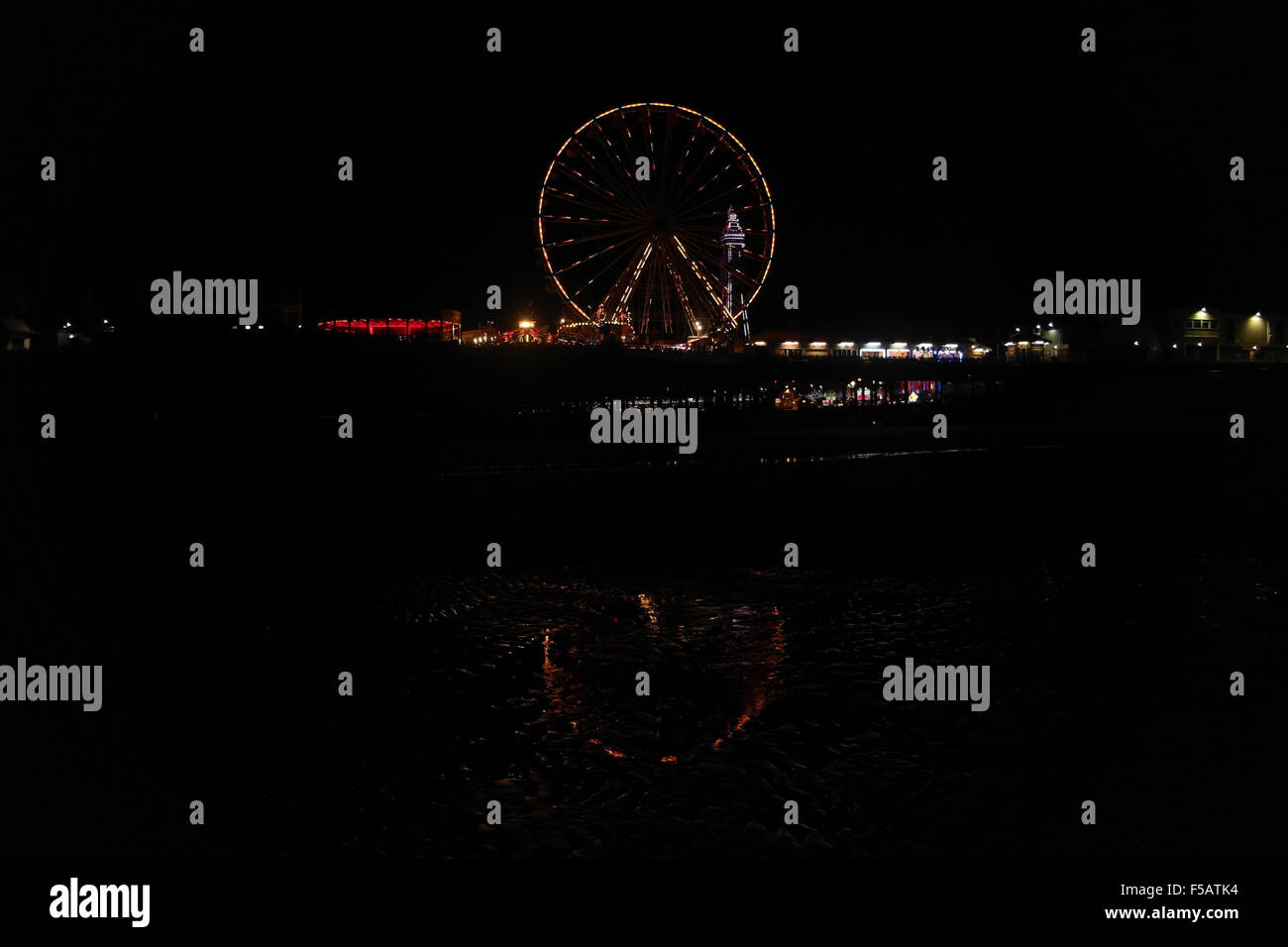 Night beach view, with reflections, north to Blackpool Tower behind ...